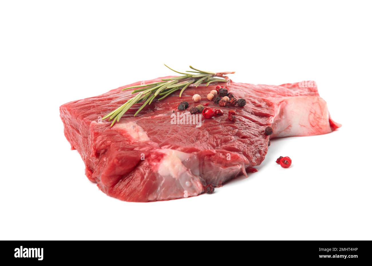Fresh raw beef cut with rosemary and peppers mix isolated on white ...