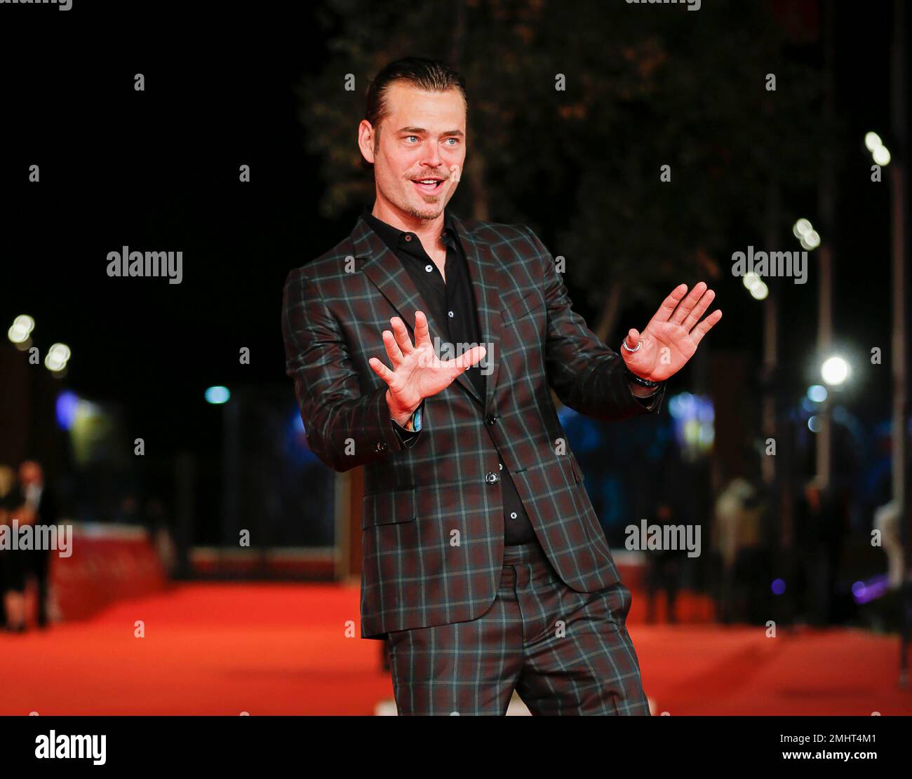 Actor Christopher Backus arrives on the red carpet for the screening of ...