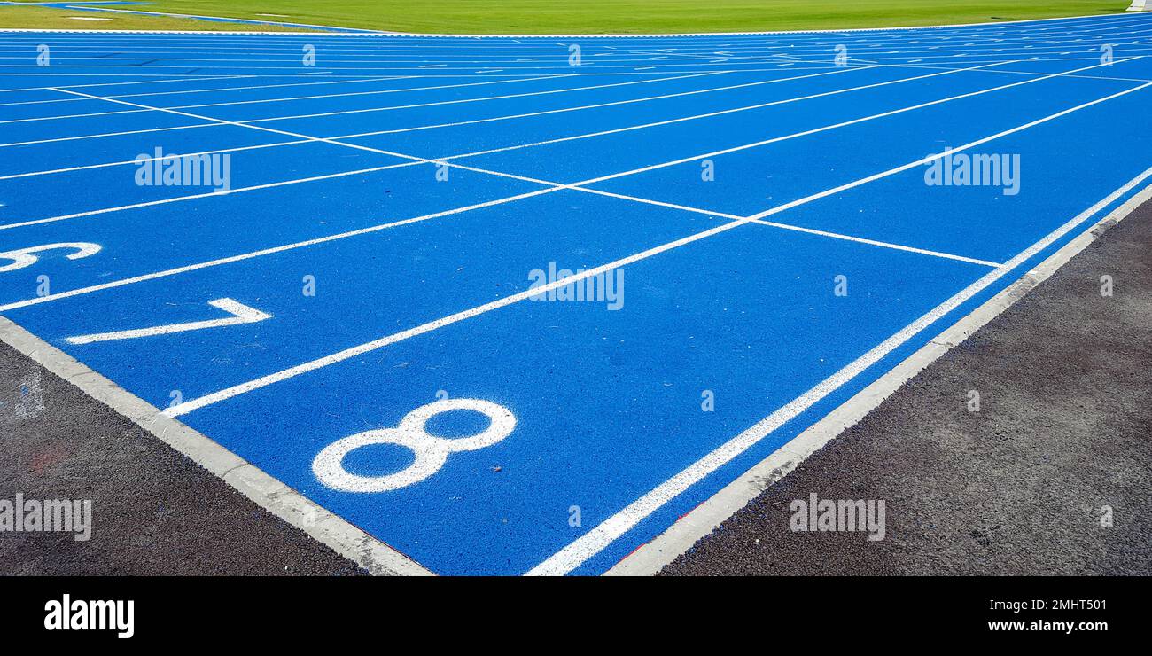 Athletics running track blue treadmill in sport field Stock Photo - Alamy