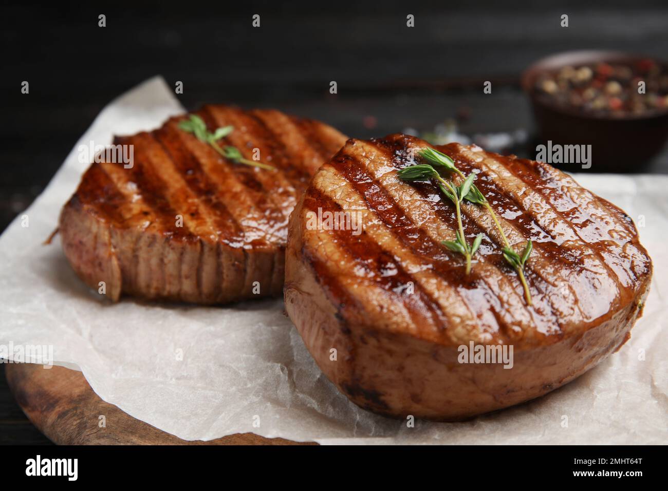 Delicious grilled beef medallions served on table, closeup Stock Photo ...