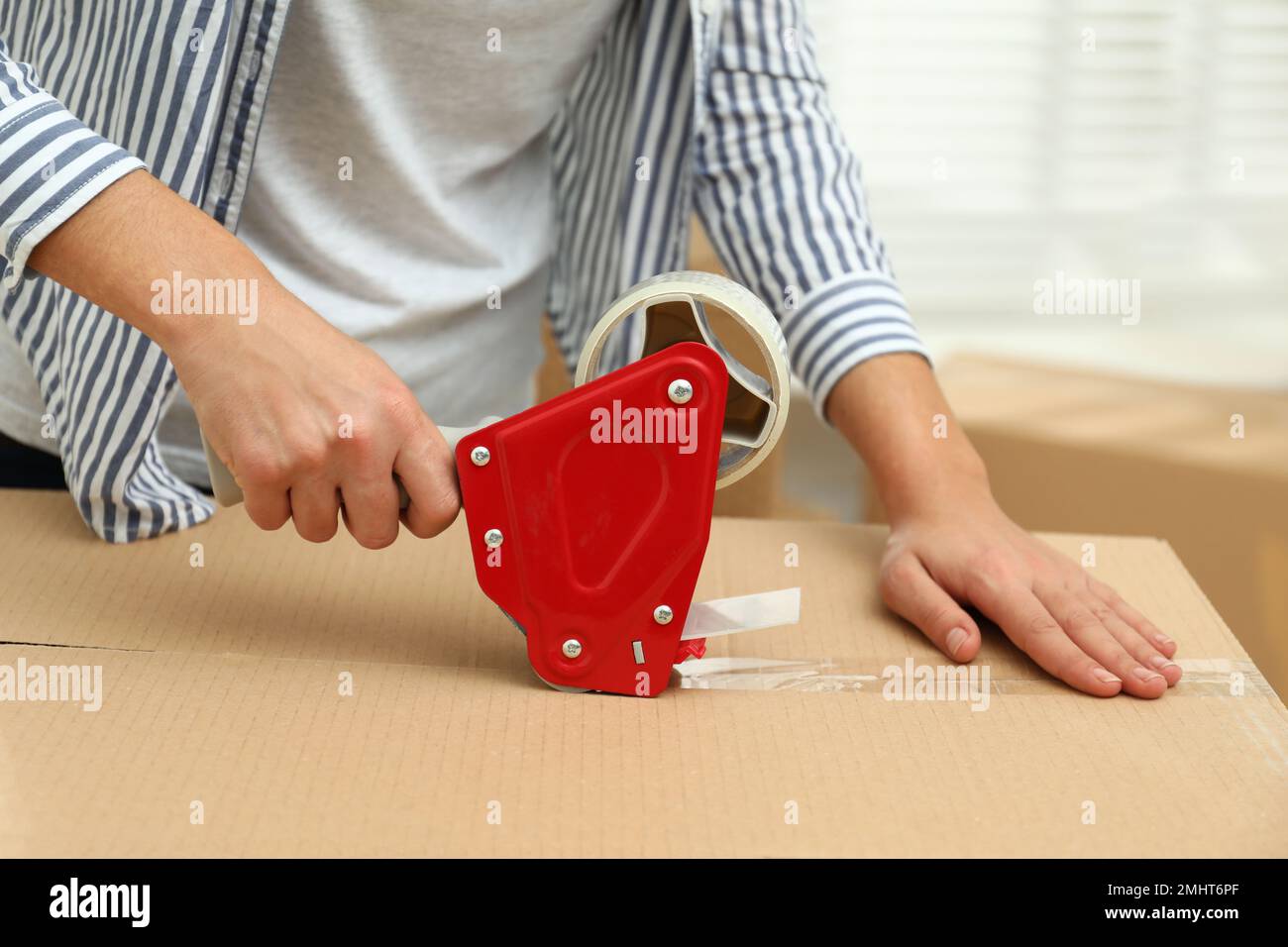 Woman packing cardboard box hi-res stock photography and images - Alamy