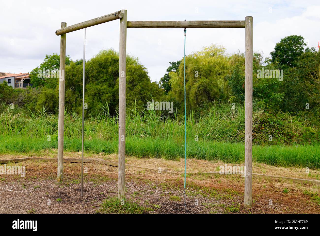 obstacle climbing using ropes for mud race runners Stock Photo - Alamy