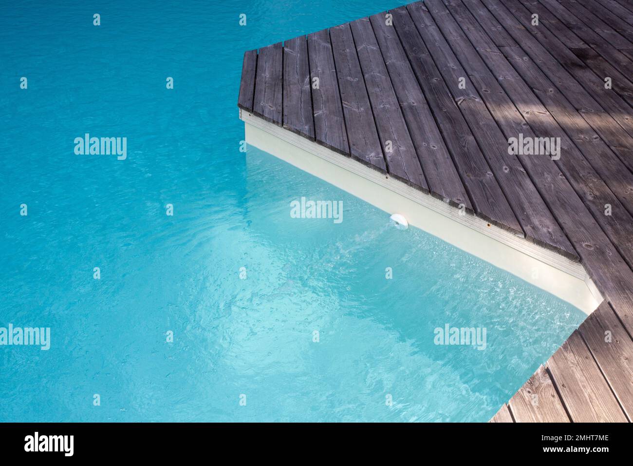 blue pool beach with wooden terrace Stock Photo - Alamy