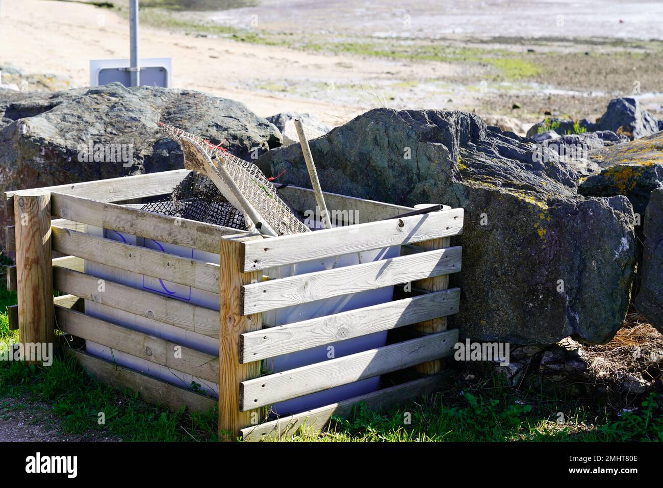 wooden large trash can to throw objects found on sand beach after tide ...