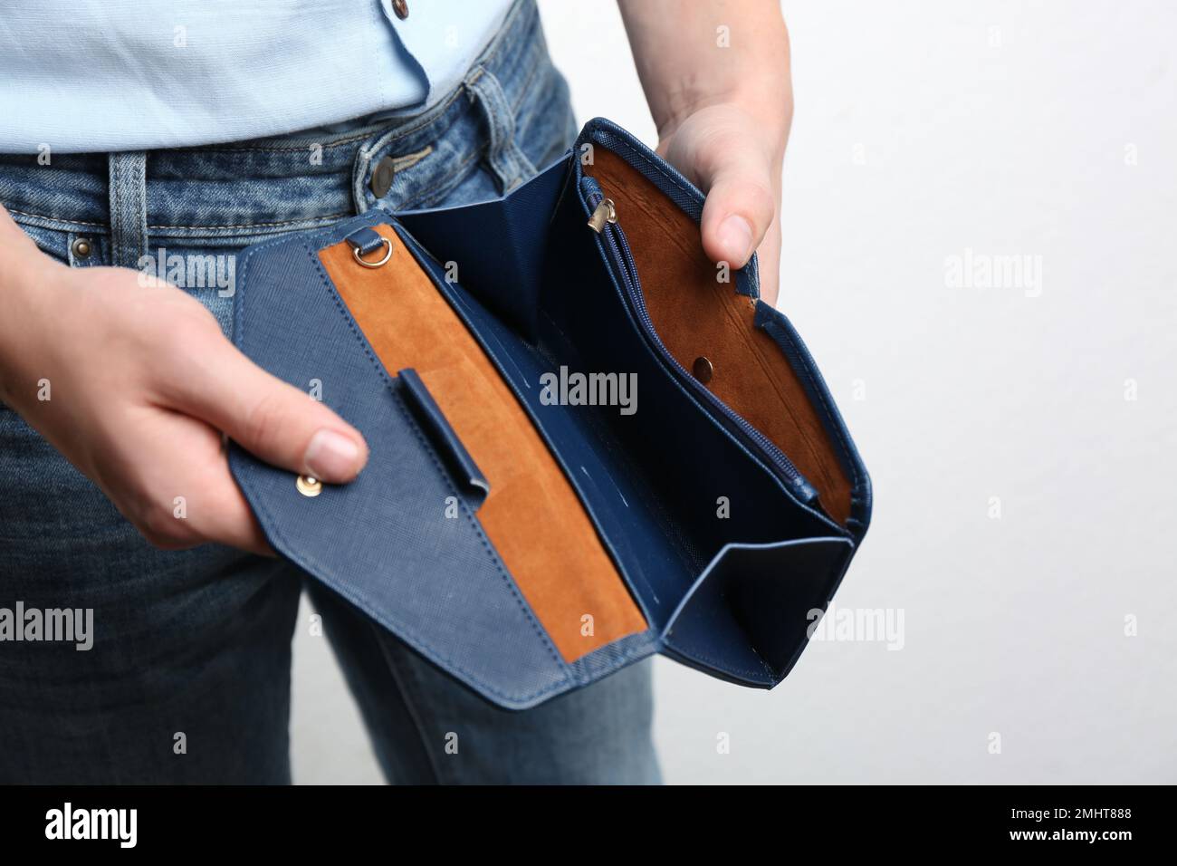 Man showing empty wallet on light background, closeup Stock Photo - Alamy Man showing empty wallet on light background, closeup Stock Photo - Alamy