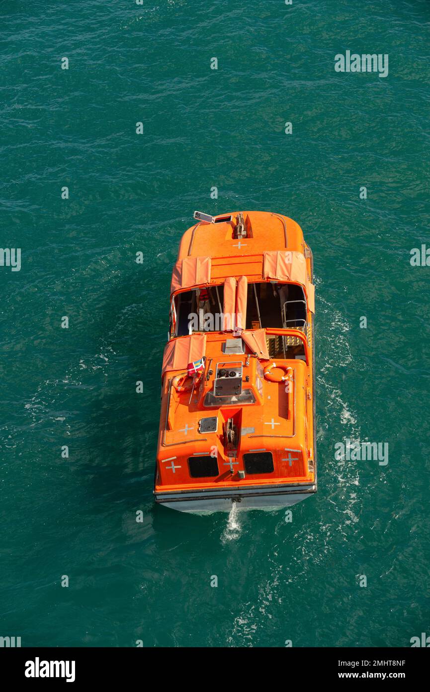 rescue lifeboat in the sea. rescue lifeboat in the ocean. orange color ...