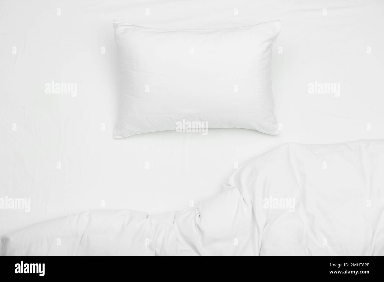 Soft white pillow and blanket on bed, top view Stock Photo - Alamy