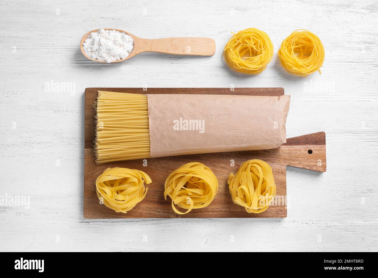 Flat lay composition with different types of pasta on white wooden ...