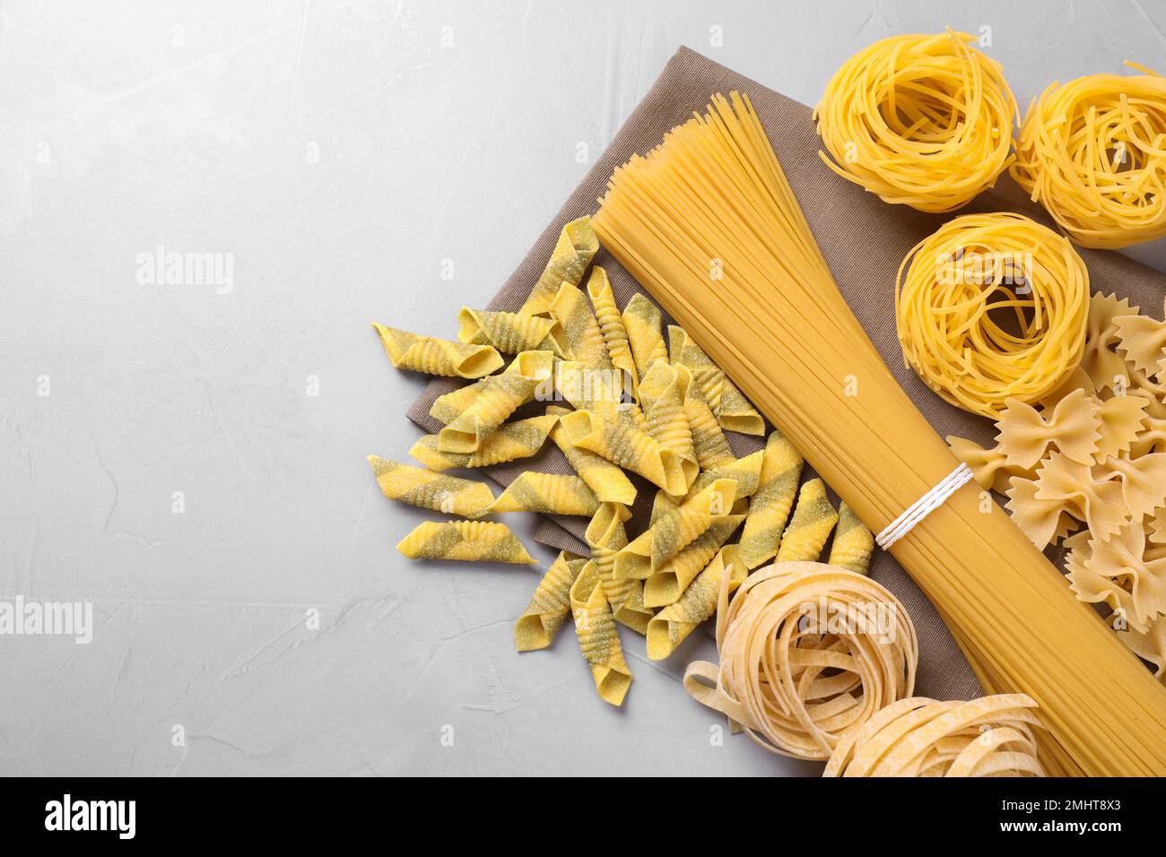 Different types of pasta on light grey table, flat lay Stock Photo - Alamy