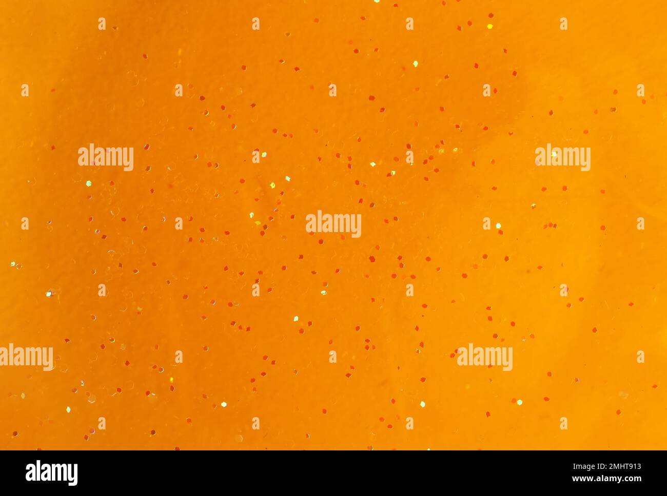 Orange slime with glitter, closeup. Antistress toy Stock Photo - Alamy