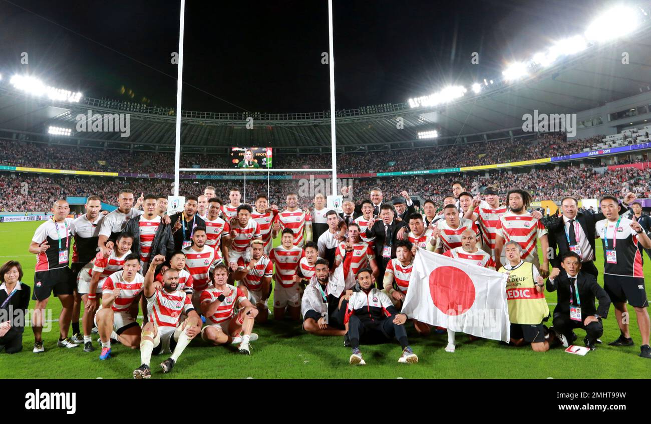 Japan team players and staff pose for a group photo after the Rugby ...