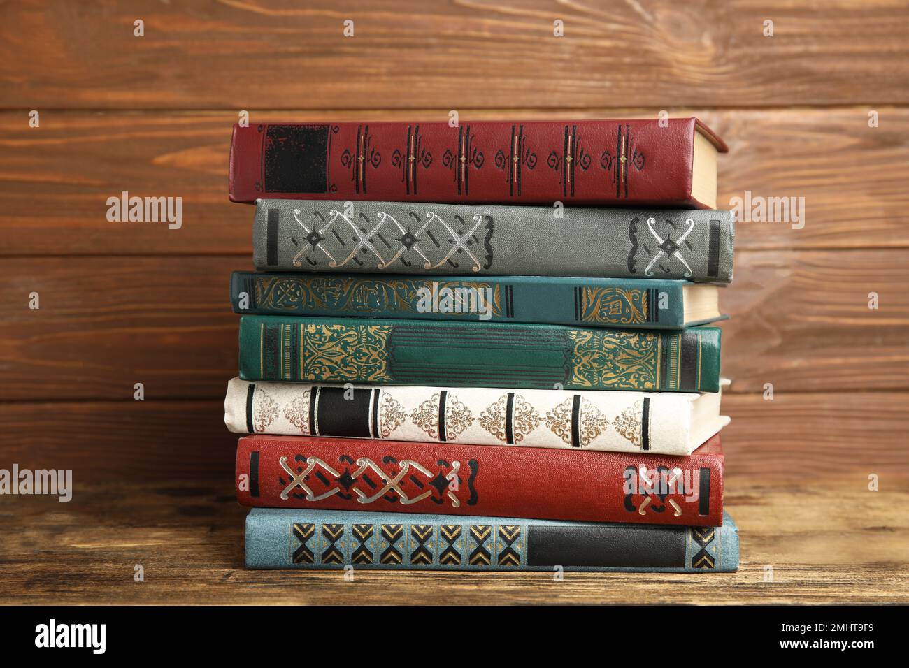 Collection of old books on wooden shelf Stock Photo - Alamy