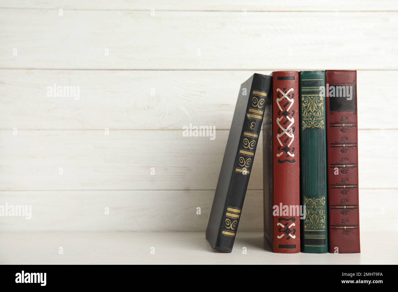 Collection of old books on white shelf. Space for text Stock Photo - Alamy