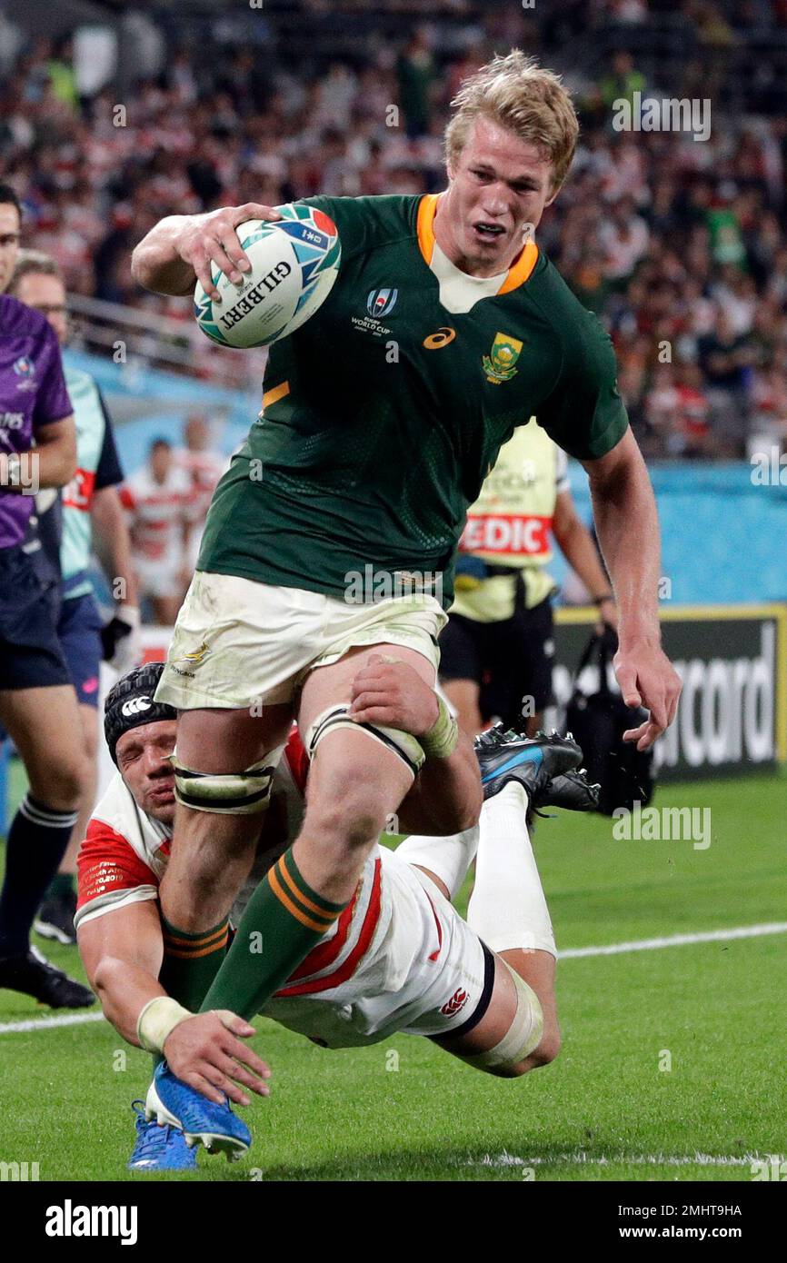South Africa's Pieter-Steph du Toit is tackled during the Rugby World ...