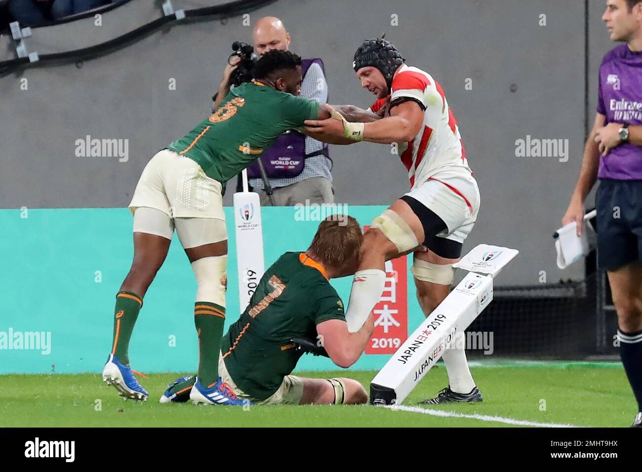 Japan's Pieter Labuschagne, right, and South Africa's Siya Kolisi, left ...