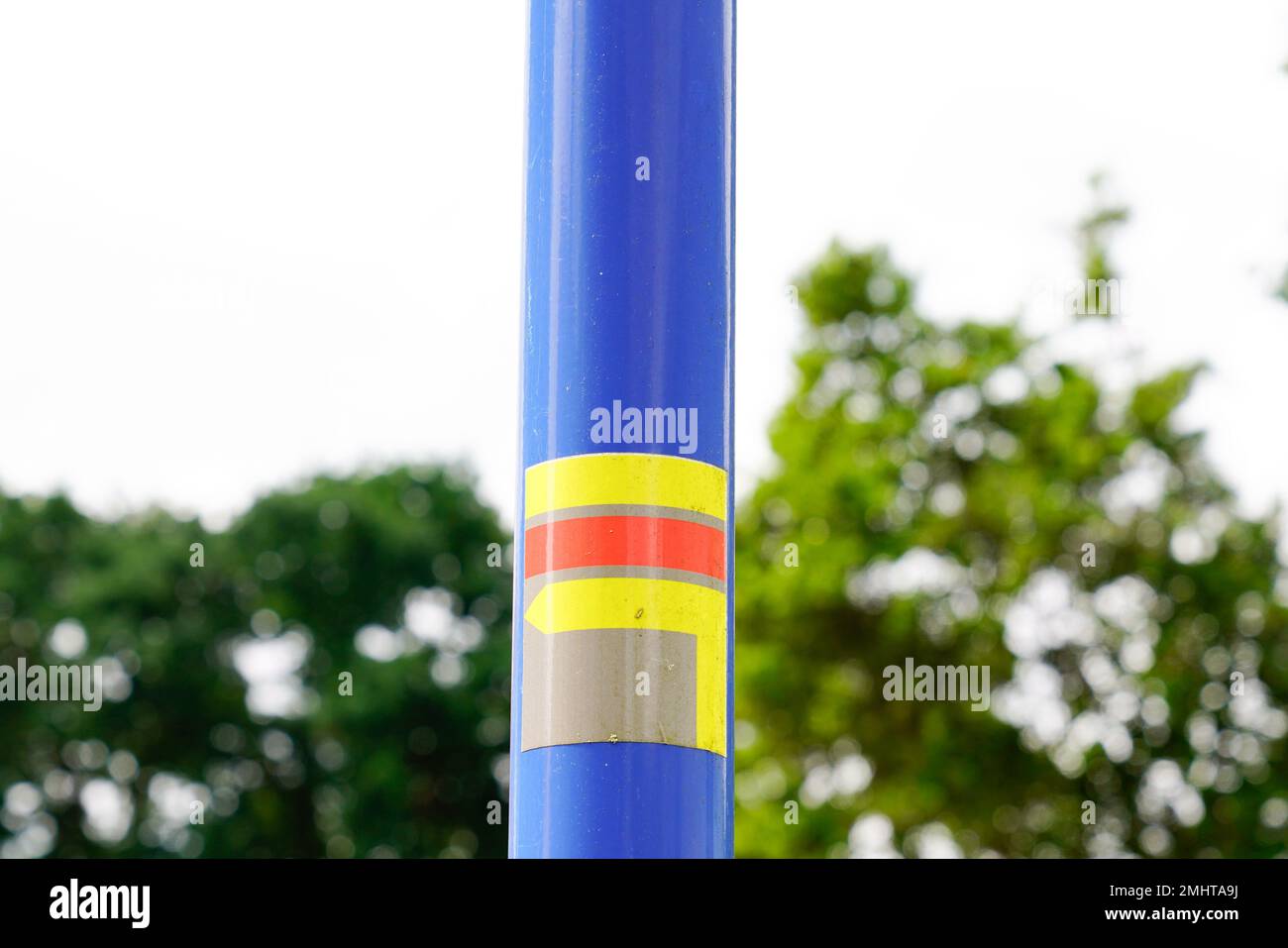 Marking markup arrow for tourist route hiking trail path sign in park ...