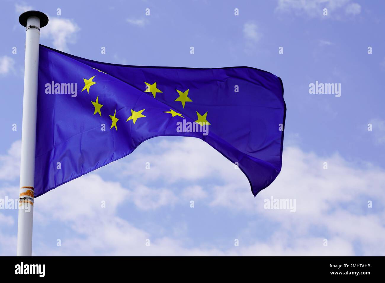 European Union EU Flag Waving in mat on cloud sky background Stock ...