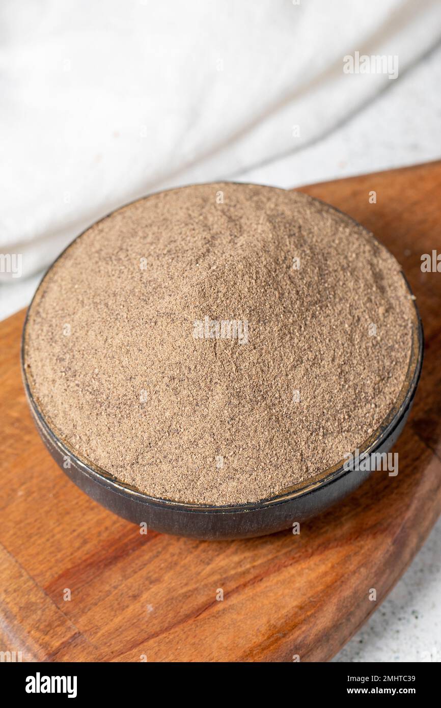 Black pepper spice. Ground black pepper spice on stone background. Dry ...