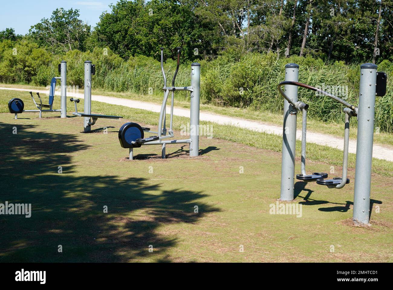 Free outdoor gym grey exercise stations in public park with outdoors ...