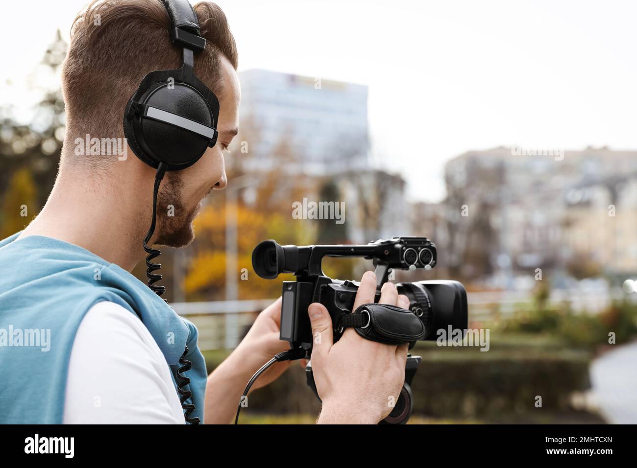 Professional video camera operator working his equipment video hi-res ...