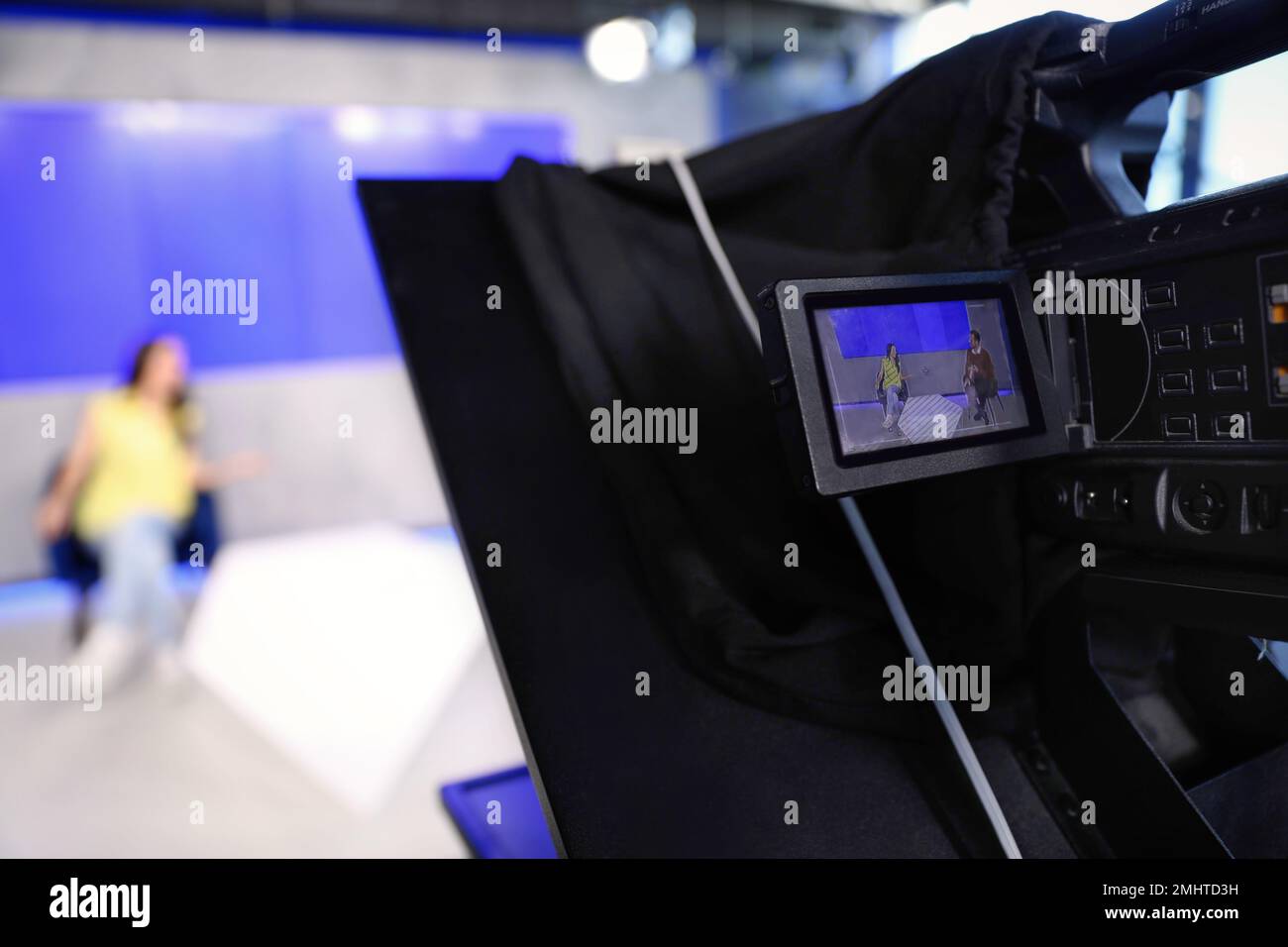 Presenters working in studio, focus on video camera screen Stock Photo ...