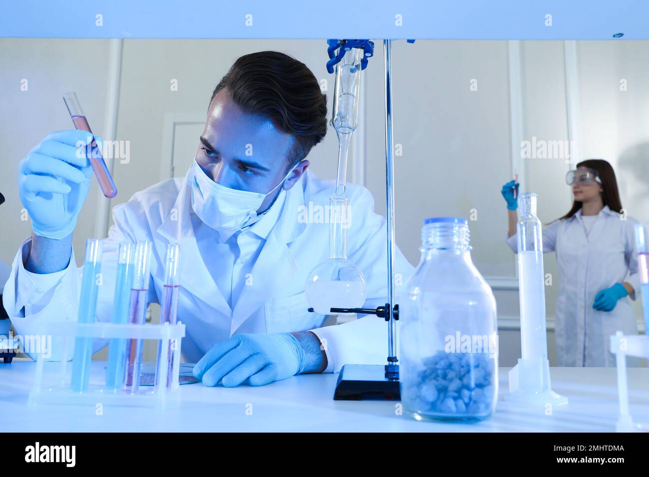 Scientist taking test tube from rack indoors. Laboratory analysis Stock ...