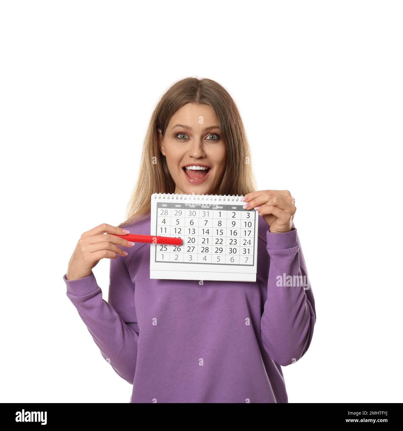 Young woman holding calendar with marked menstrual cycle days on white ...