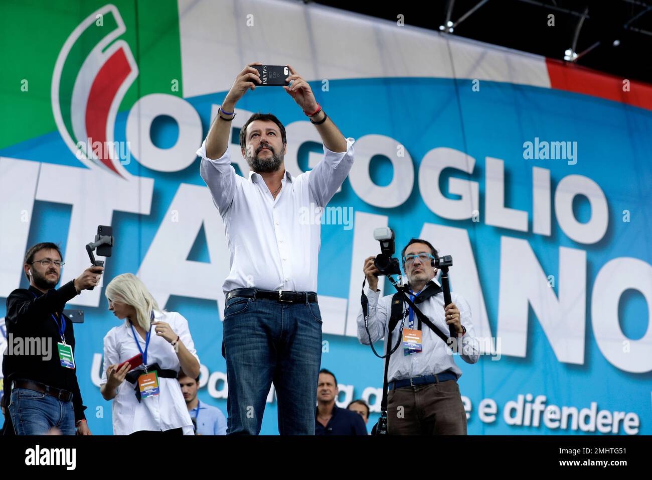 The League leader Matteo Salvini takes a photo as he arrives on a stage ...