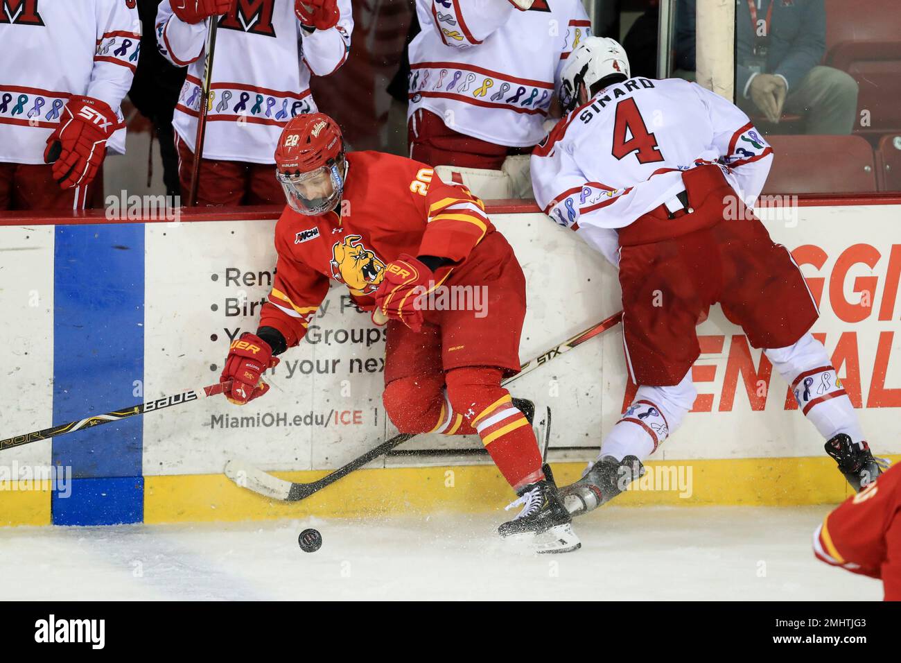 Ferris State's Liam MacDougall skates against Miami RedHawks' Andrew ...