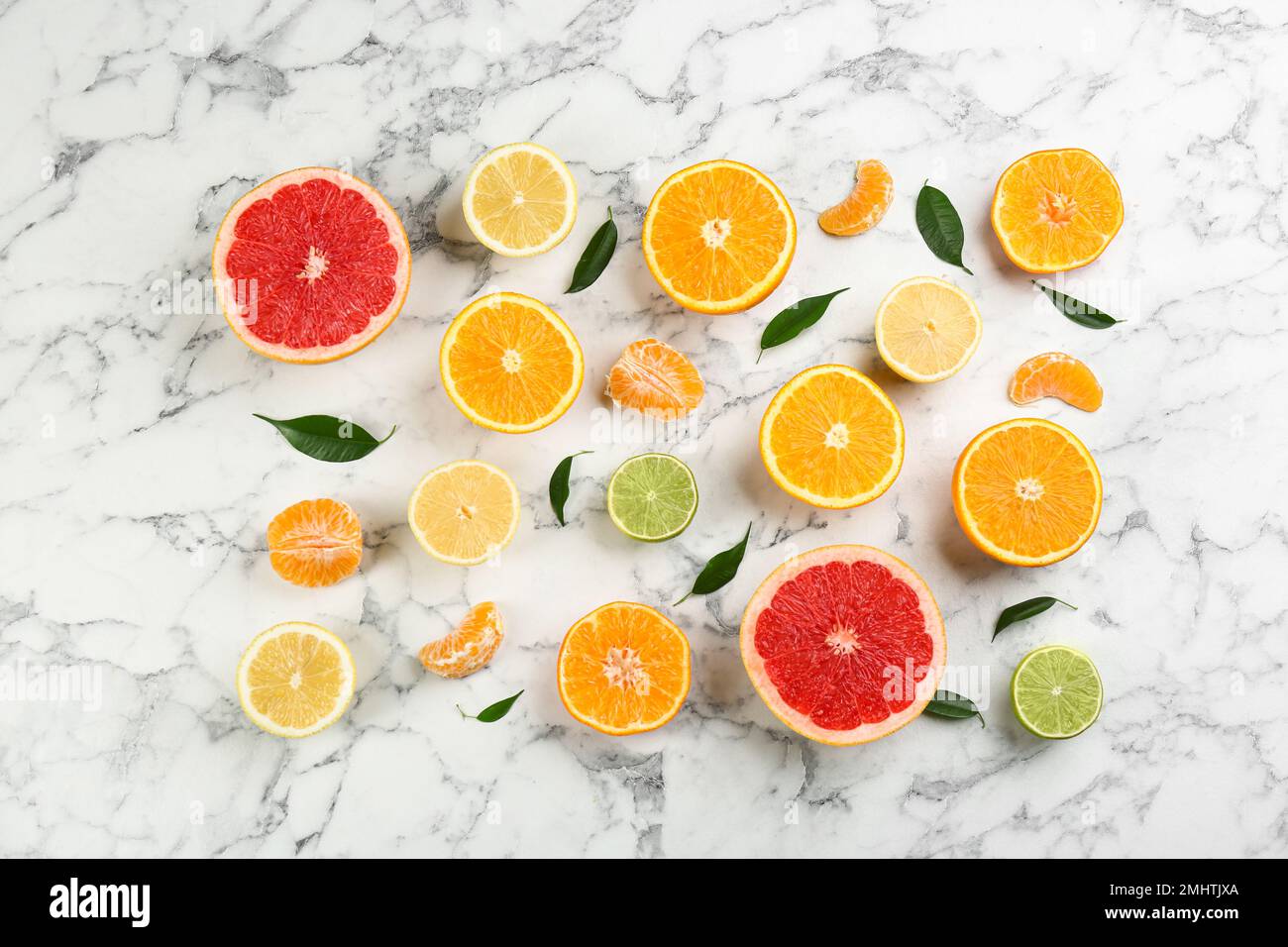 Flat lay composition with tangerines and different citrus fruits on ...