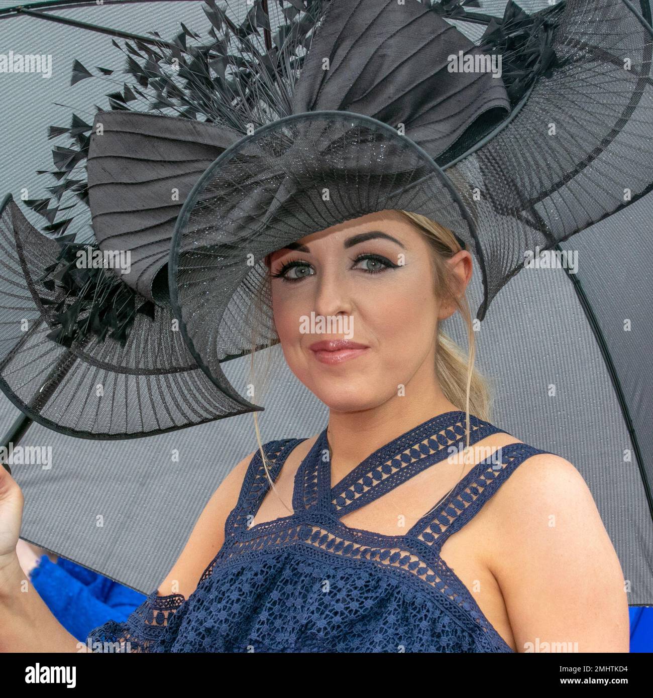 Women's high-end fashion, decorative fancy frocks and hats. Racegoers ...