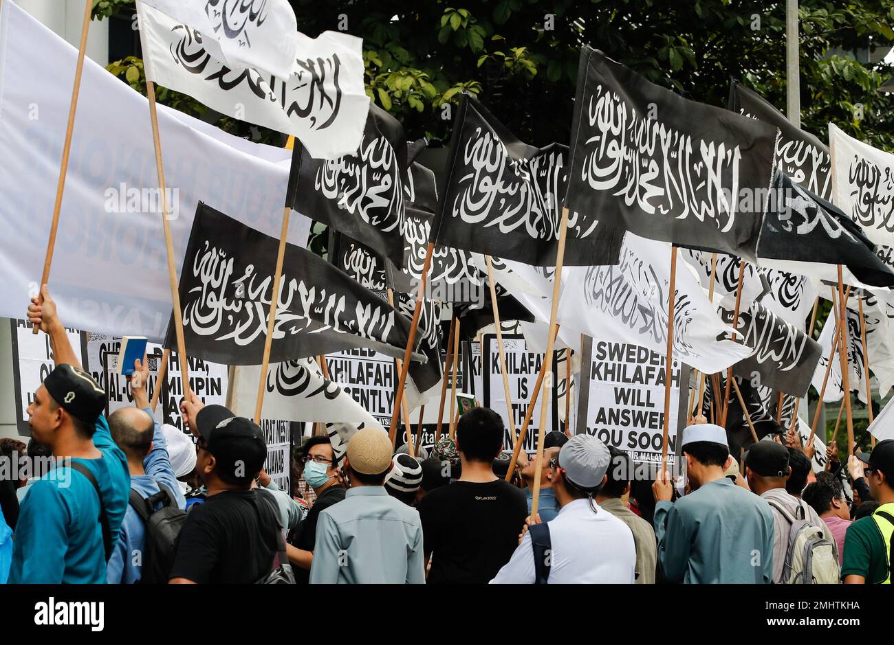 Kuala Lumpur, Malaysia. 27th Jan, 2023. Malaysian Muslims hold flags ...