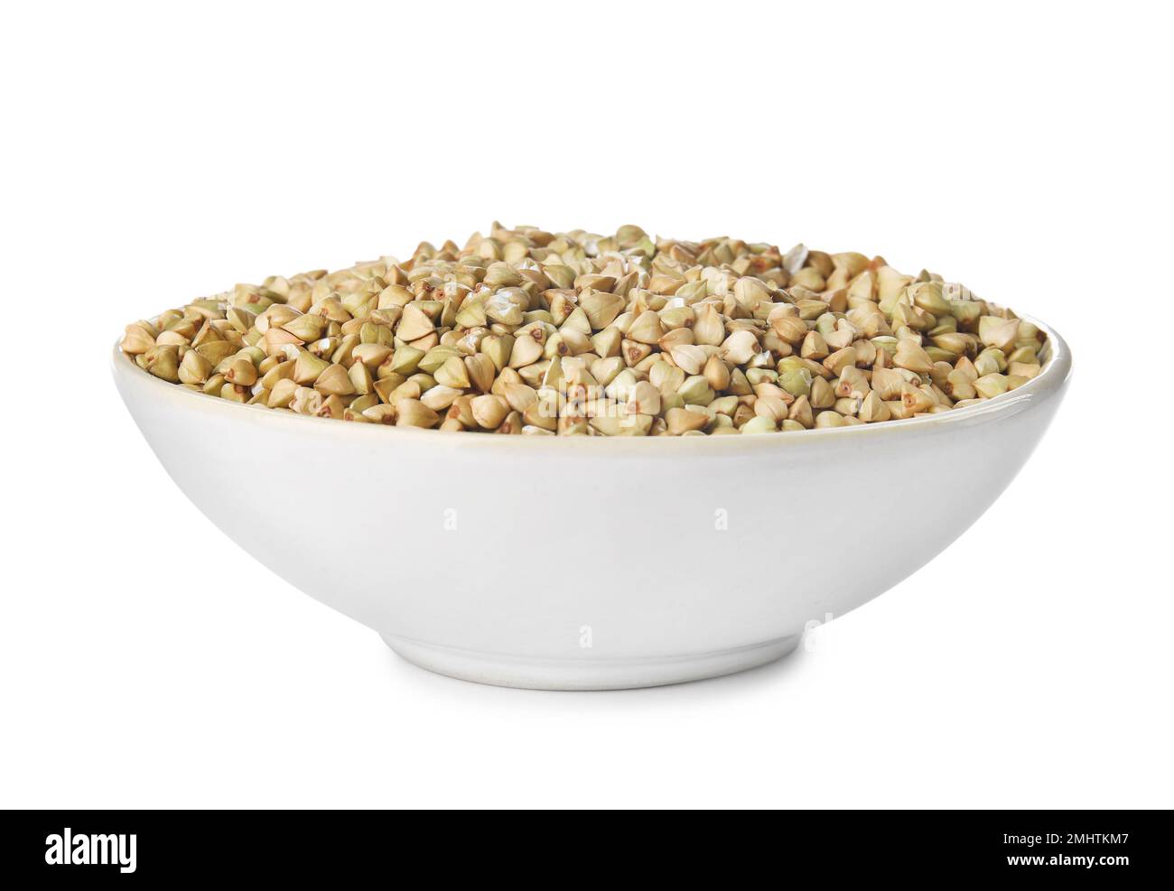 Uncooked green buckwheat grains in bowl isolated on white Stock Photo ...