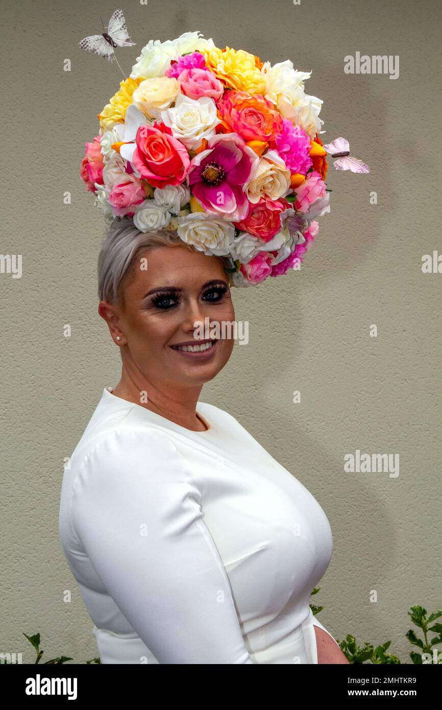 Women's high-end fashion, decorative fancy frocks and hats. Racegoers ...