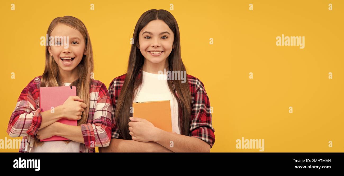 School girls friends. cheerful kids going to do homework with books ...