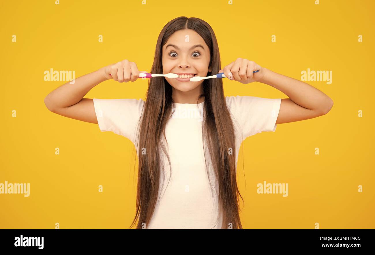 Funny face. Funny teen girl brush her teeth, dental healthy concept ...