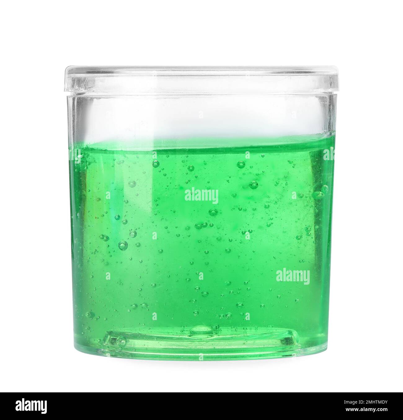 Green slime in plastic container isolated on white. Antistress toy ...
