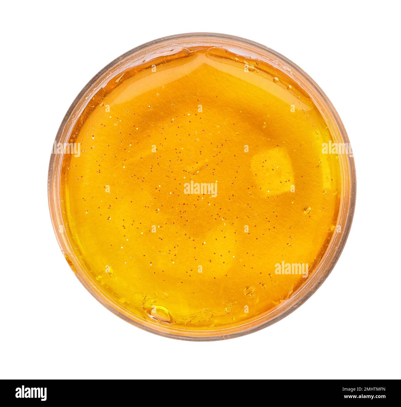 Orange slime with glitter in plastic container isolated on white, top ...