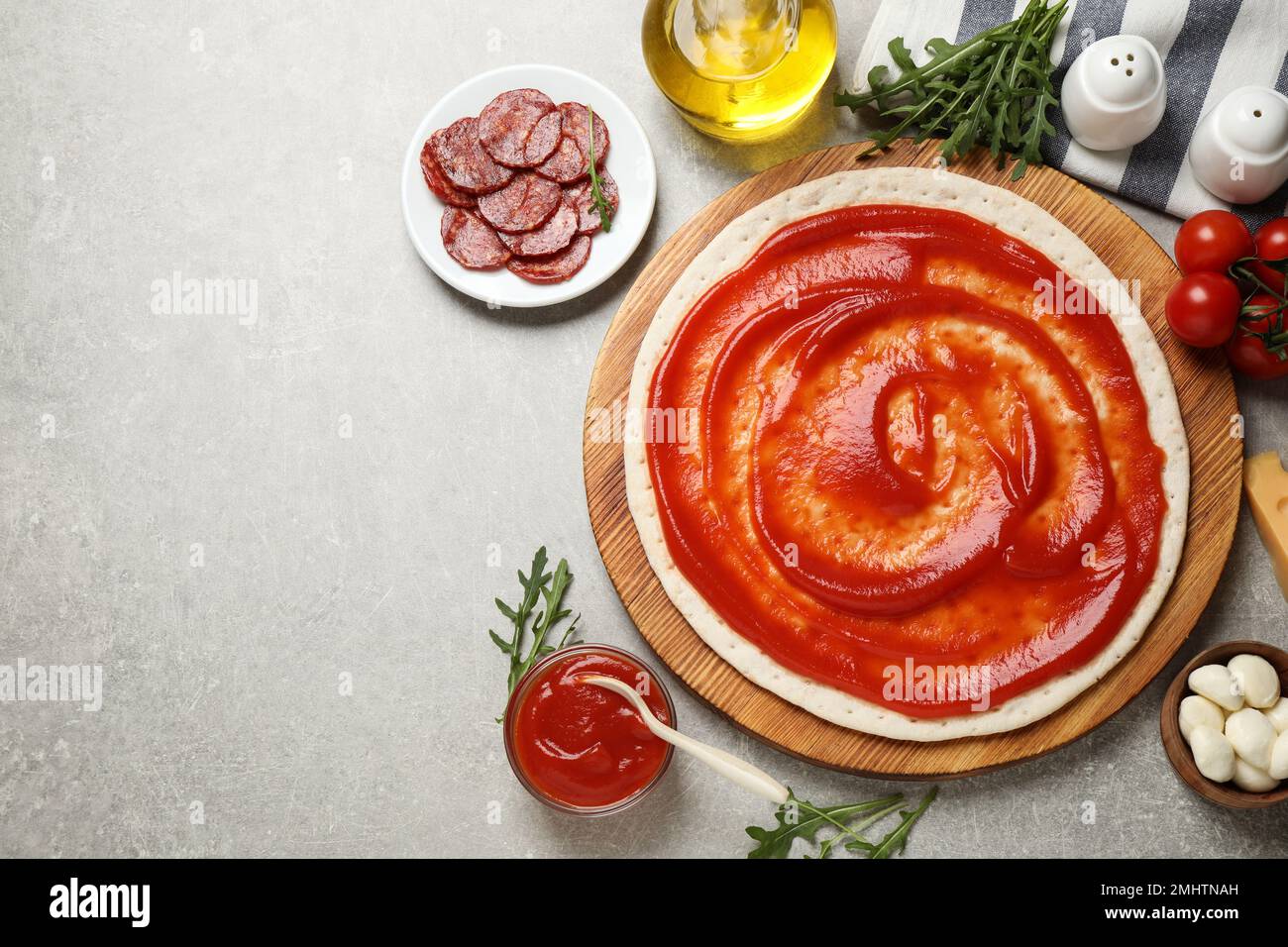 Flat lay composition with base and ingredients on light grey table ...