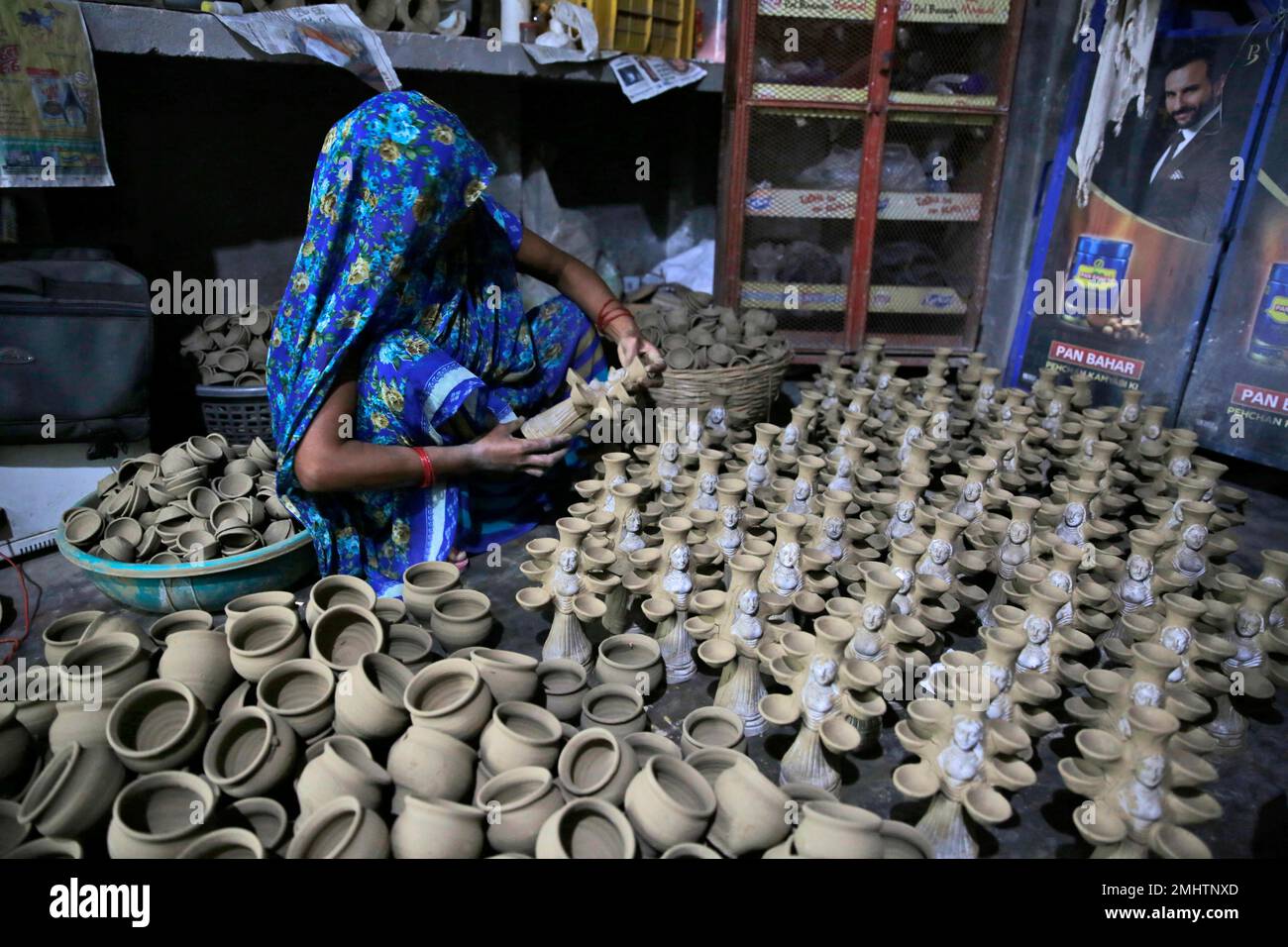 An Indian potter gives finishing touches to Hindu goddess Lakshmi ahead ...