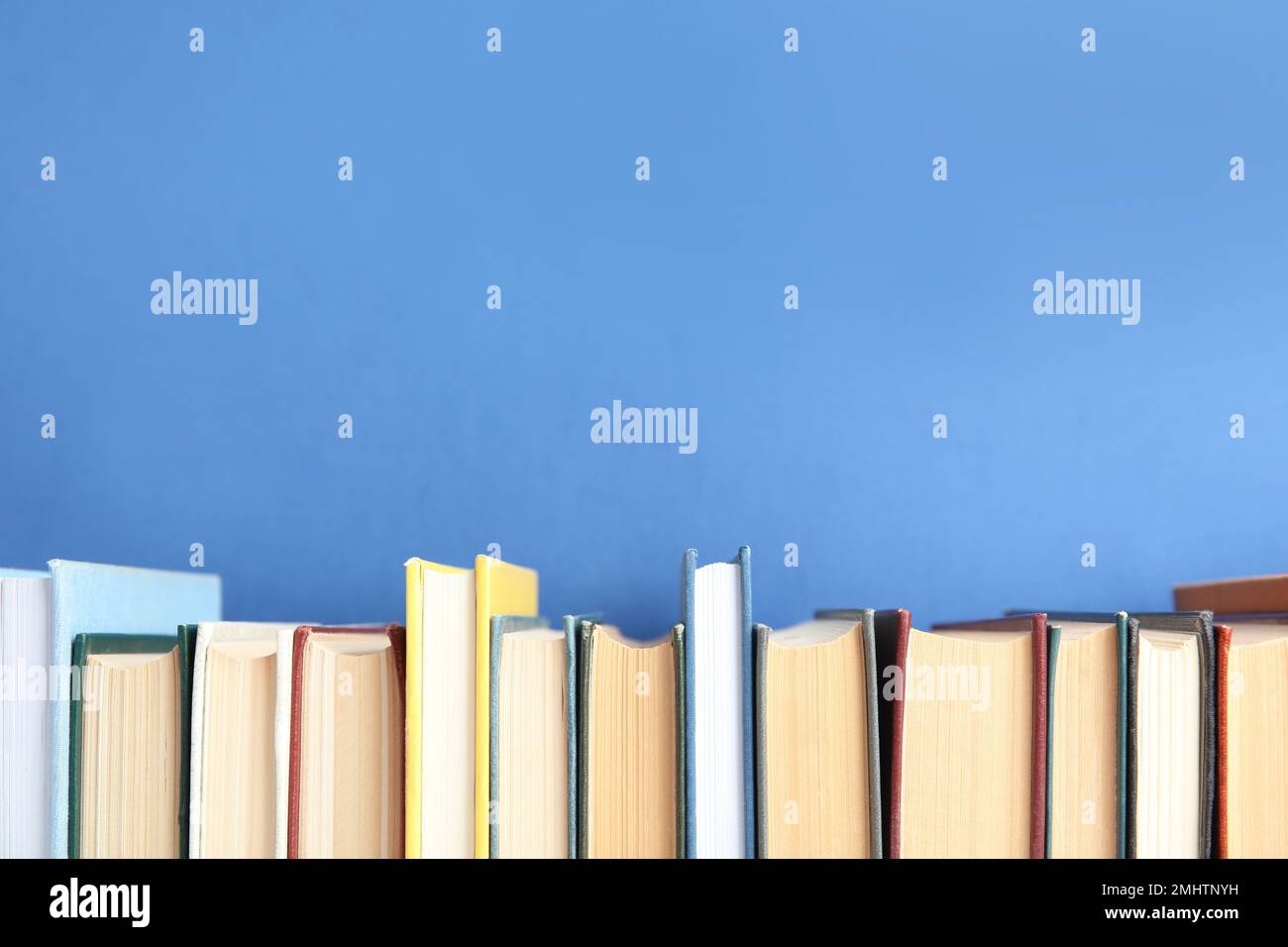 Collection of old books on blue background. Space for text Stock Photo ...