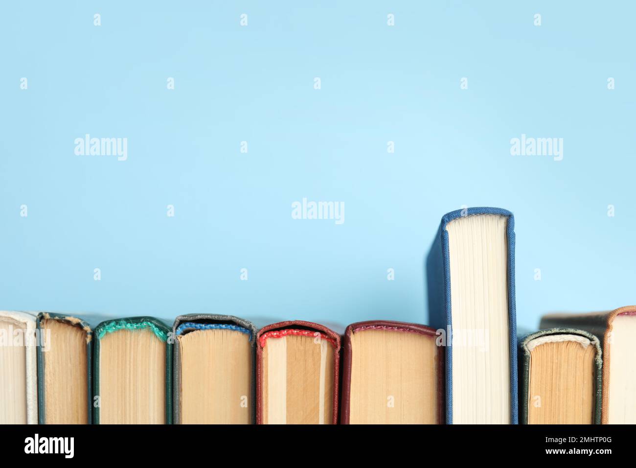 Collection of old books on light blue background. Space for text Stock ...