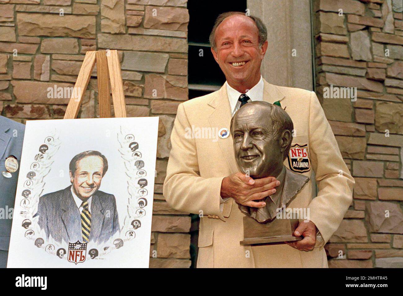 FILE - In this Aug. 3, 1985, file photo, Pete Rozelle poses with a ...
