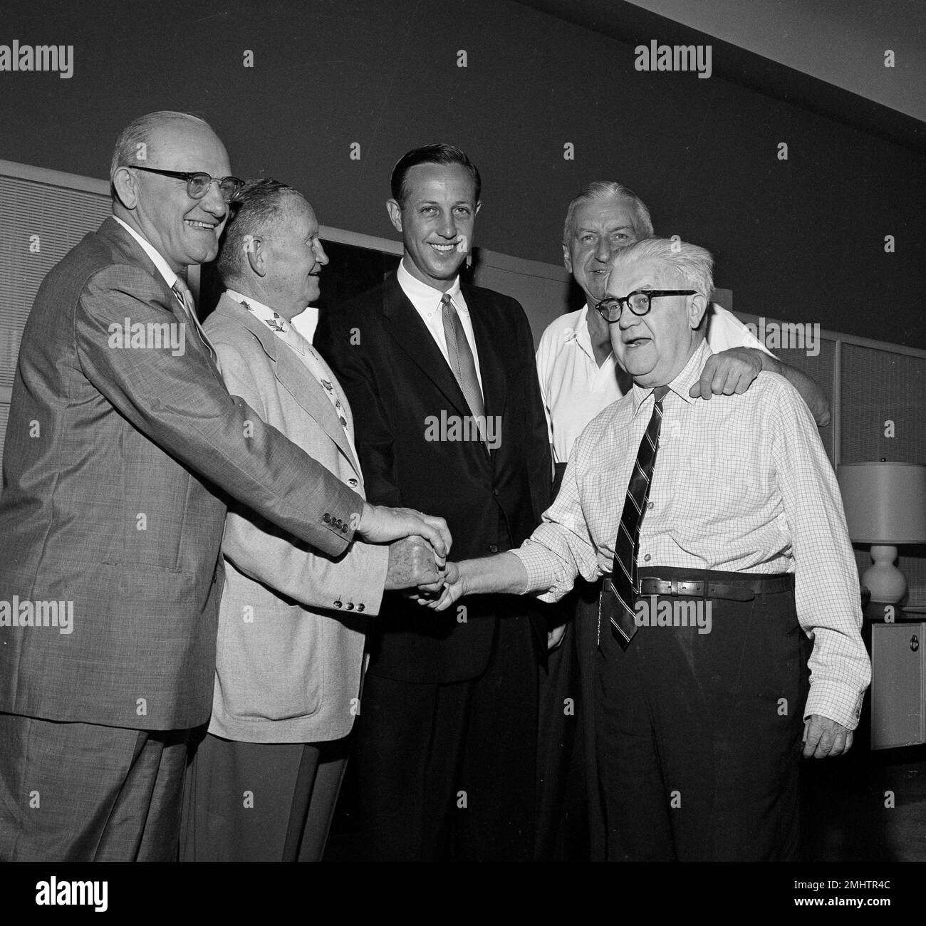 FILE - In this Jan. 27, 1960, file photo, Pete Rozelle, center, the ...