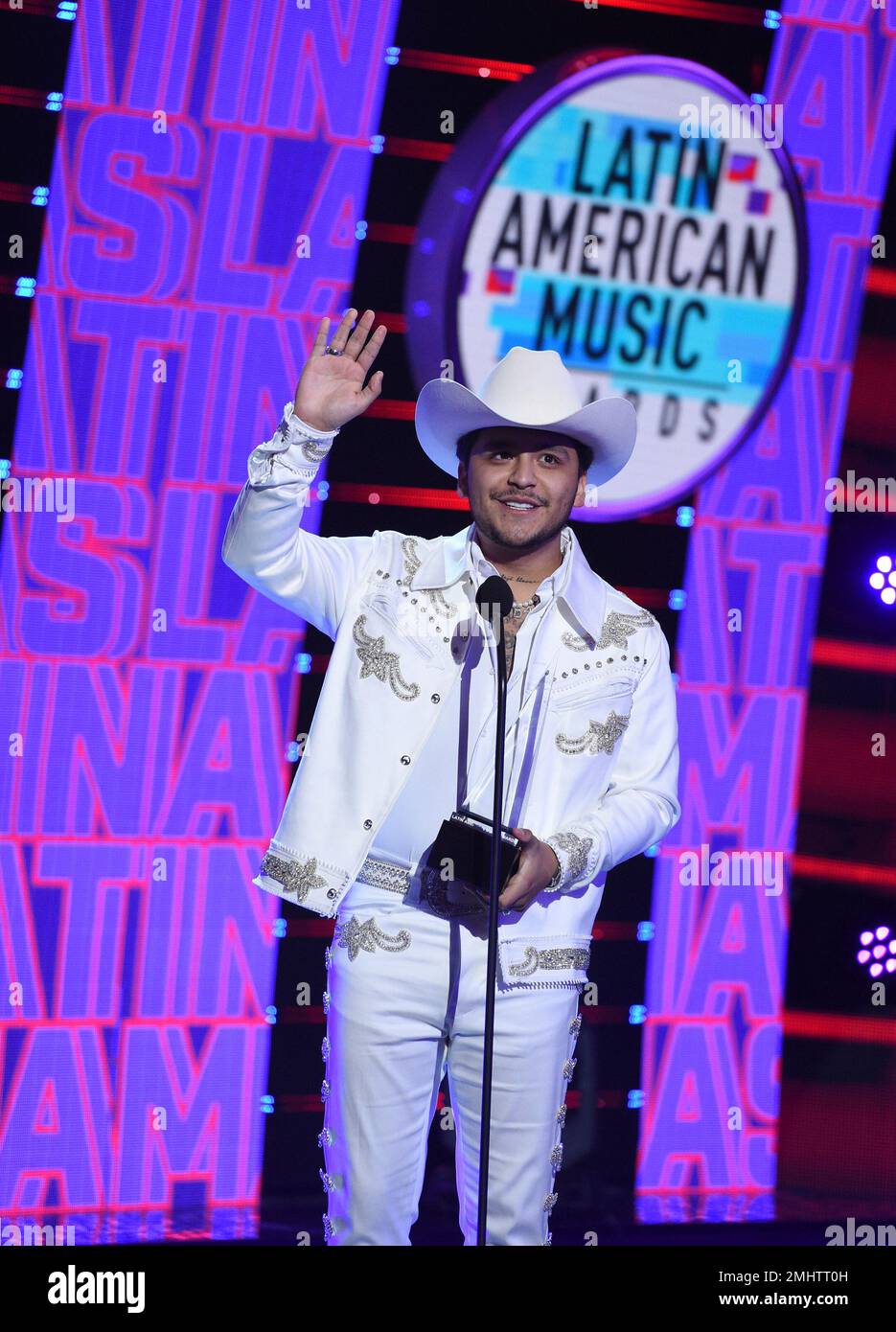 Christian Nodal accepts the award for favorite regional mexican song ...