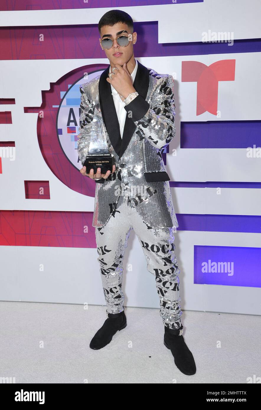 Lunay poses backstage with the award for new artist of the year award ...
