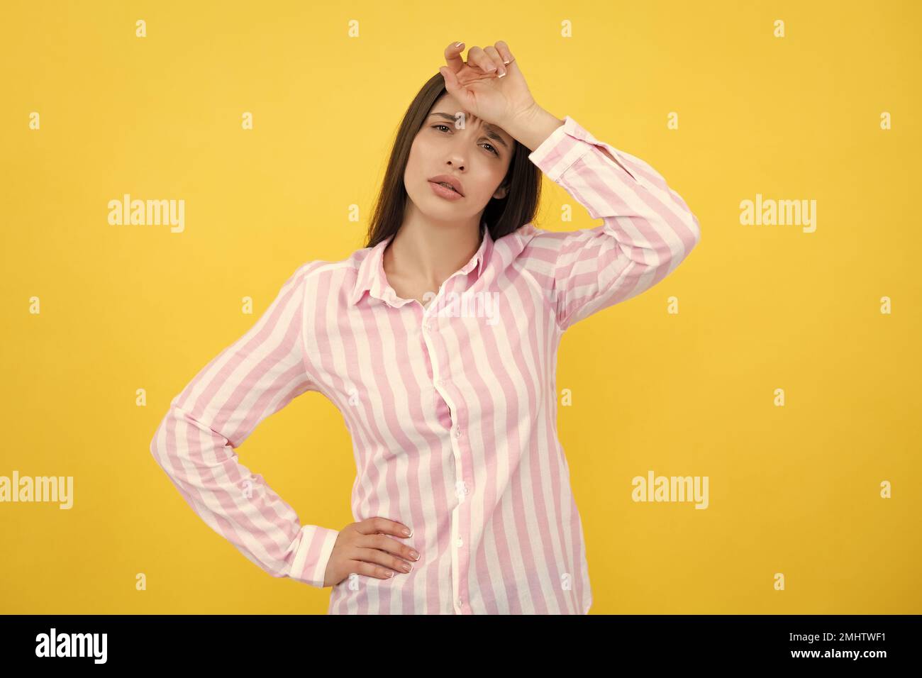 Portrait of young woman feeling stress or strain headache. Exhausted ...