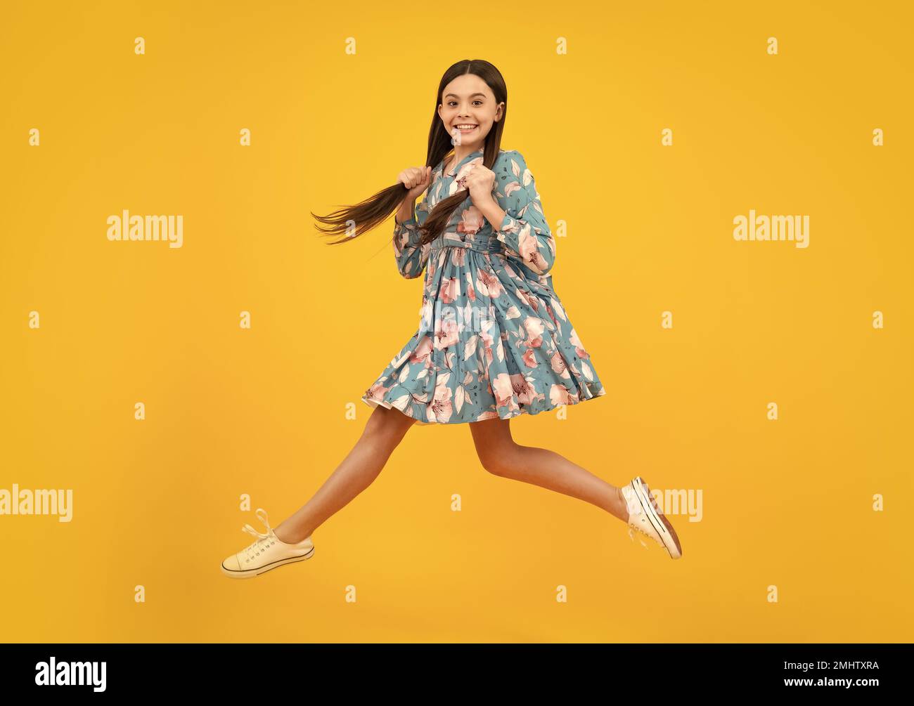 Happiness, activity and child. Teenager girl jumping on isolated ...