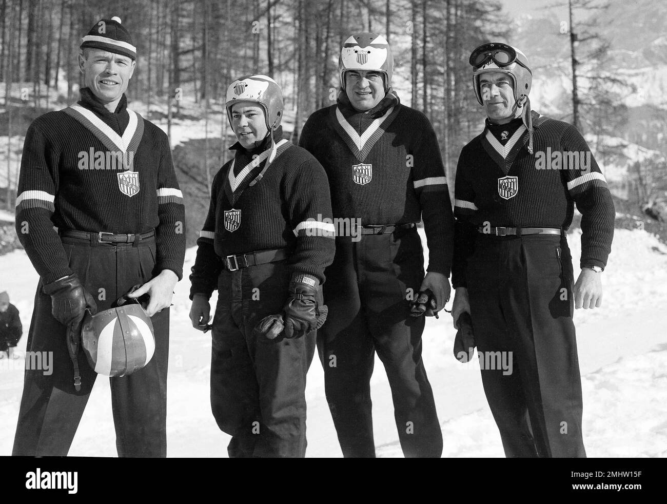 Members of the crew of the number one sled of the U.S. team that is ...