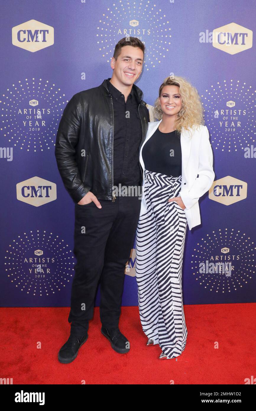 Tori Kelly, right, with her husband, Andre Murillo arrive at 2019 CMT ...